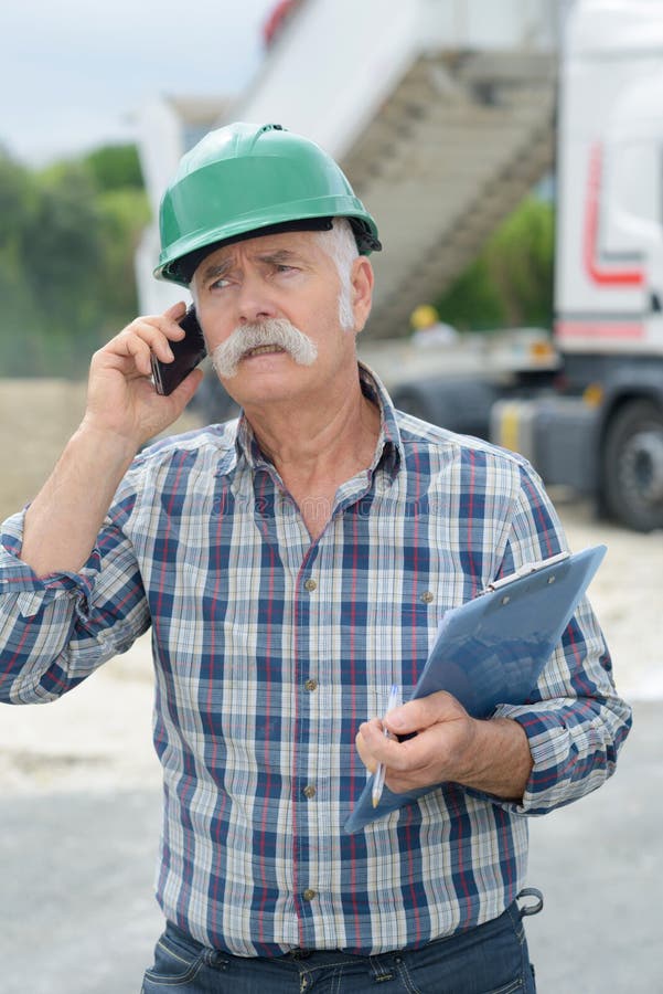 Senior Workman Outdoors Speaking on Telephone Stock Photo - Image of ...