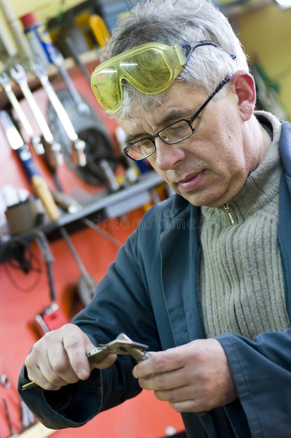 Senior workman portrait stock image. Image of workshop - 4778301