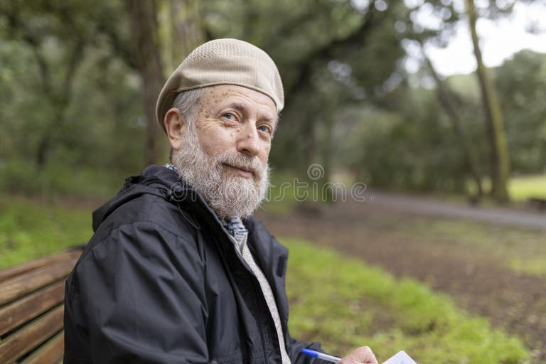 Senior Writer Taking Notes while Sitting on Bench in Park Stock Image ...