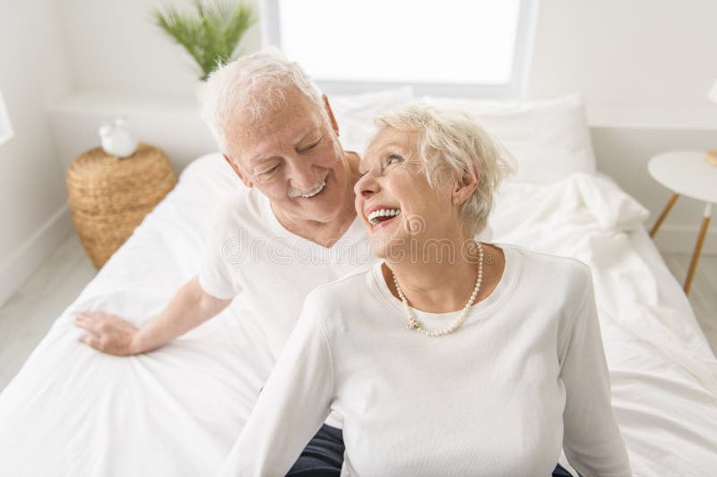 Senior 80 Years Old Couple Relaxing in Bed Together Stock Photo - Image ...