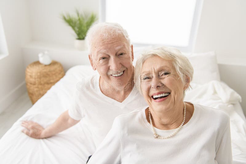 Senior 80 Years Old Couple Relaxing in Bed Together Stock Image - Image ...
