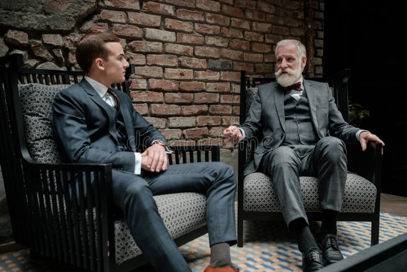 Senior and Young Gentlemen Having Conversation Stock Image - Image of ...