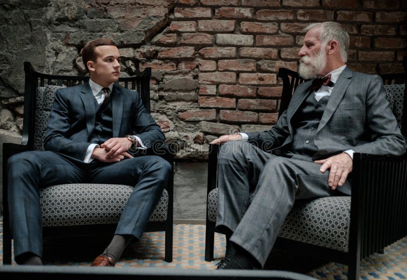 Senior and Young Gentlemen Having Conversation Stock Photo - Image of ...