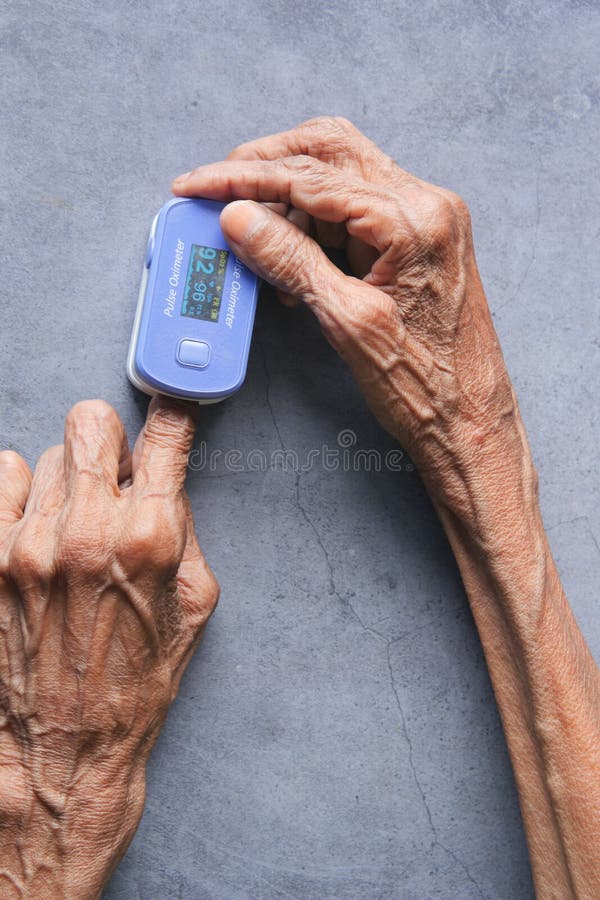 Senior Young Women Hand Using Pulse Oximeter Stock Photo - Image of ...