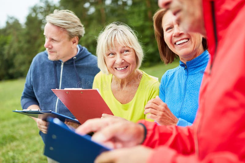 Seniors with Clipboard at Scavenger Hunt Stock Photo - Image of task ...