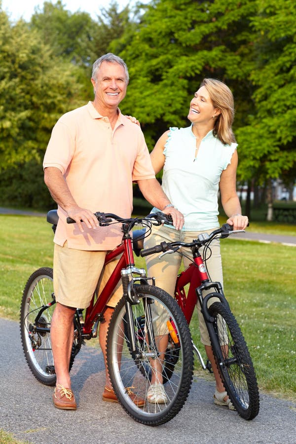 Biking Seniors in the Park stock image. Image of biking - 3091279
