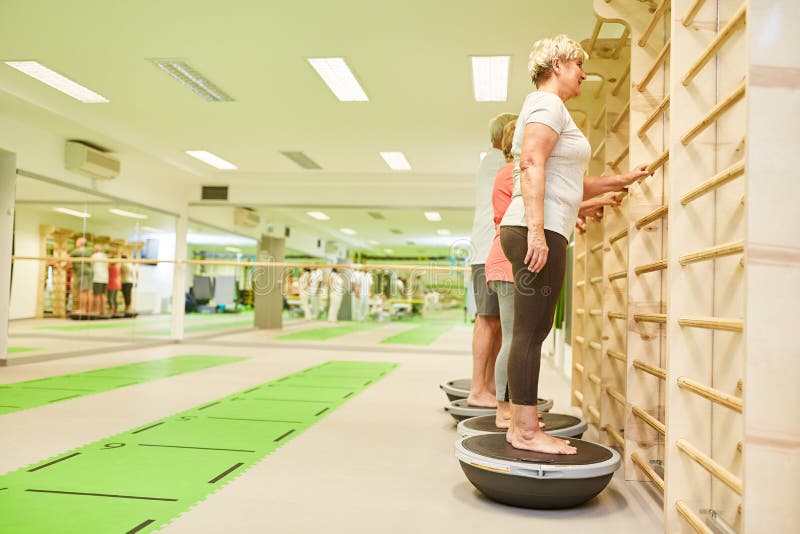 Seniors Doing Balance Training on the Wall Bars Stock Photo - Image of ...