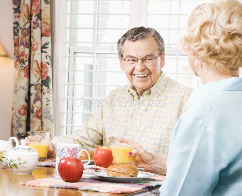 Seniors eating breakfast stock photo. Image of indoors - 2848624