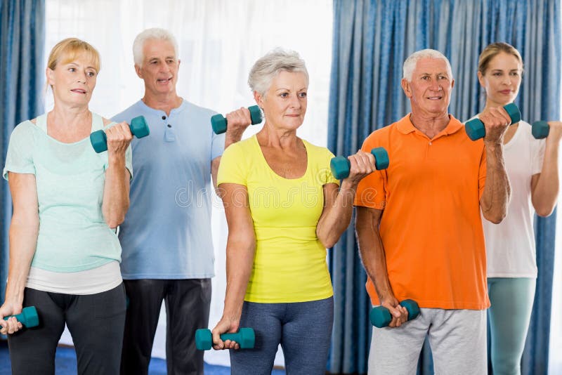 Concentrated Seniors Holding Hands Together in Circle Stock Image ...