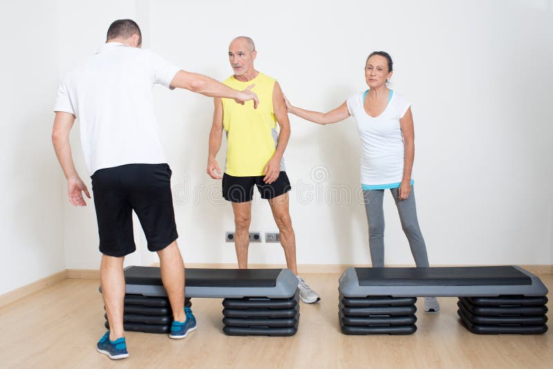 Senior Step Exercise with Personal Trainer Stock Photo - Image of ...