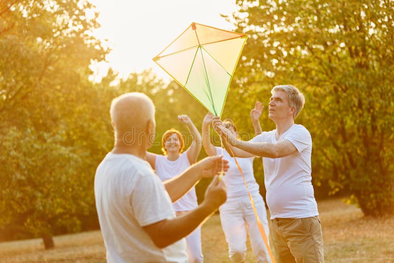 Seniors fly kites stock photo. Image of fall, citizens - 171769954