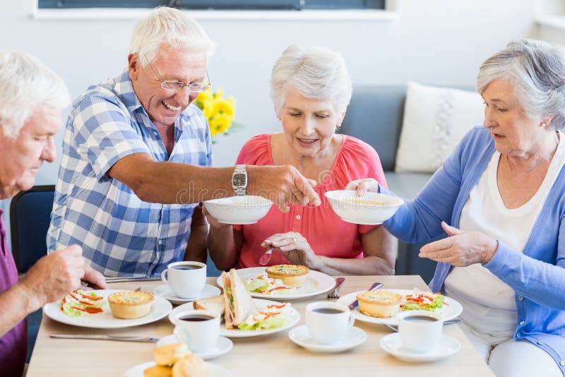 Seniors Having Lunch Together Stock Photo - Image of fondness, beverage ...