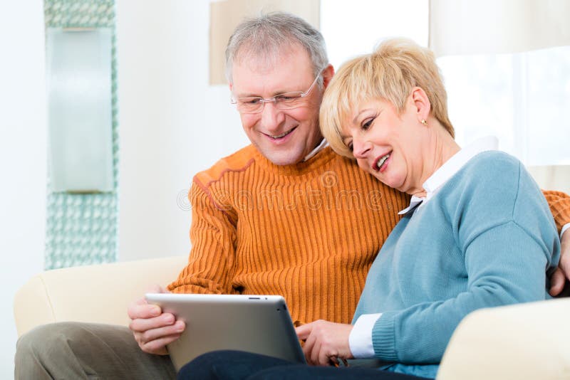 Seniors at Home with Tablet Computer Stock Image - Image of living ...