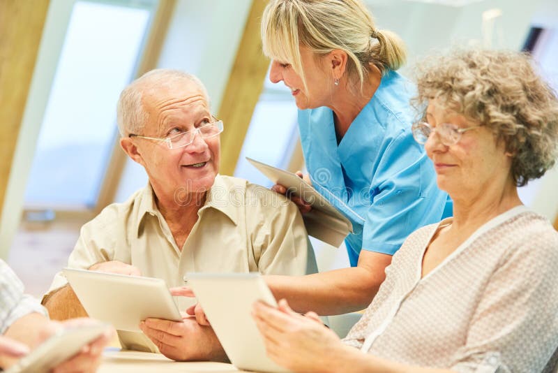 Seniors Learn with the Tablet in the Computer Course Stock Photo ...