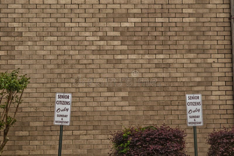 Seniors only Parking Signs and Brick Wall Stock Image - Image of nature ...