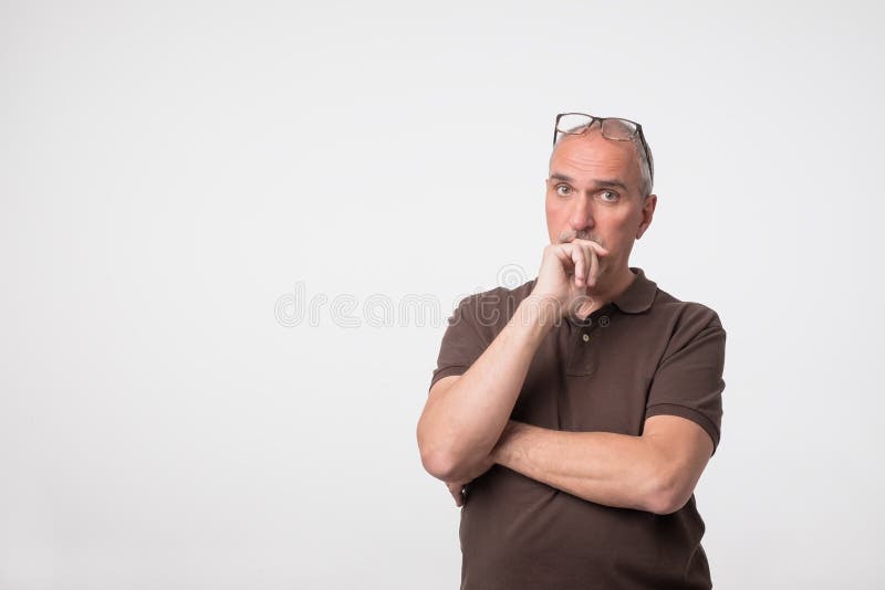 Seniors Portrait Of Contemplative Old Caucasian Man Looking At Camera