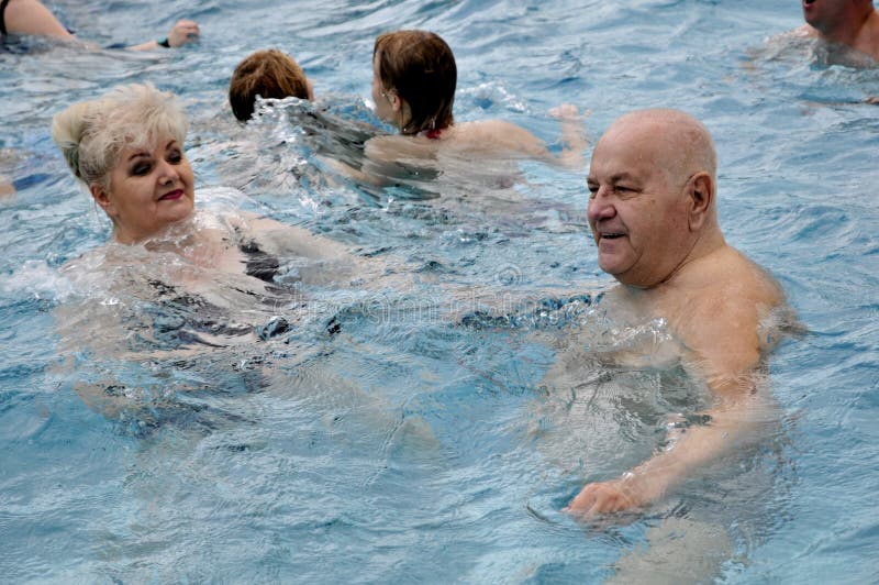 Seniors in simming pool stock photo. Image of persons - 5379310