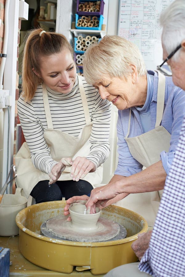 Seniors with Teacher in Pottery Class Stock Photo - Image of craft ...