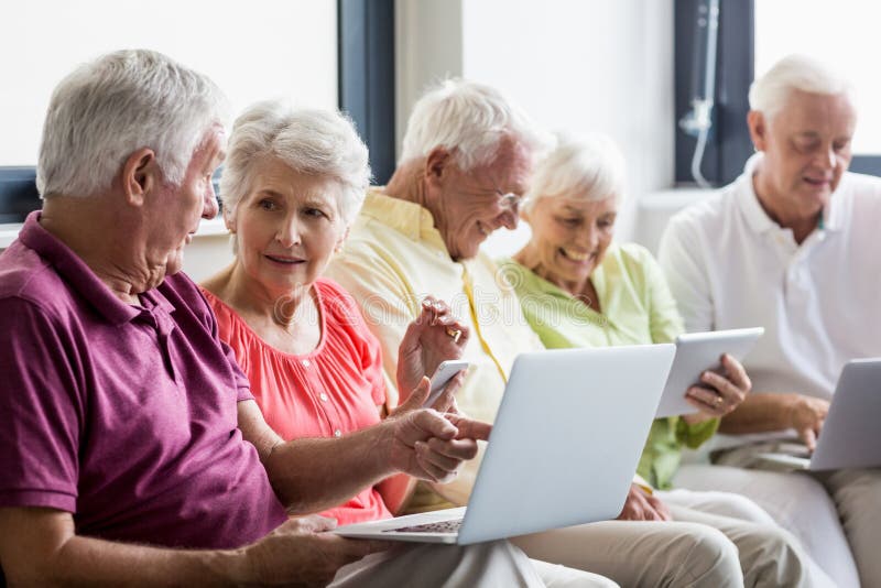 Seniors using technology stock photo. Image of leisure - 77686488