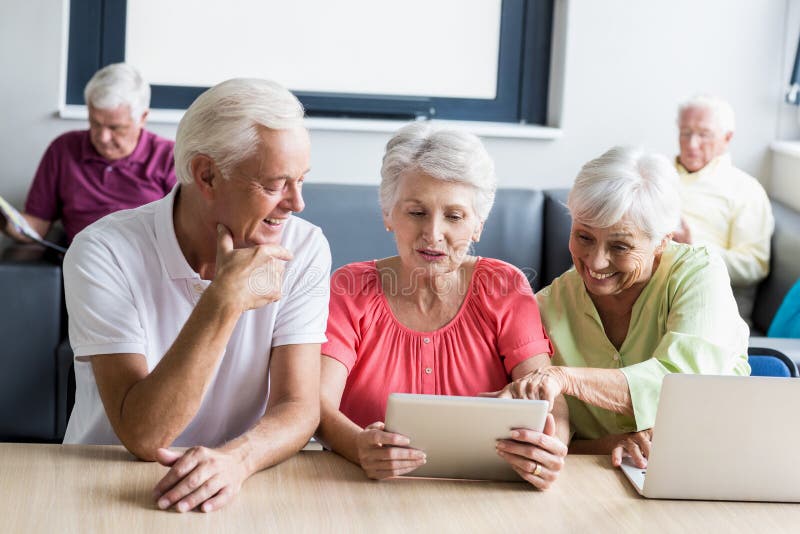 Seniors using technology stock photo. Image of daycare - 77686502