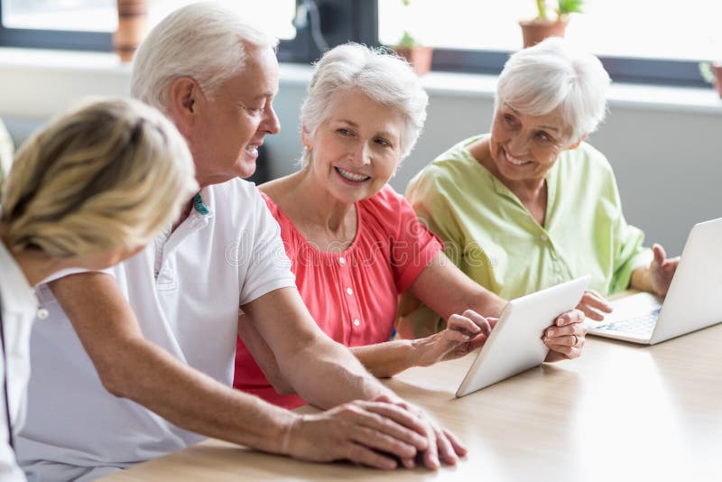 Seniors using technology stock photo. Image of citizen - 77686506