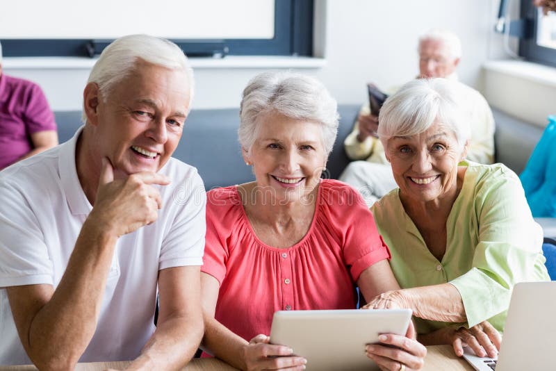 Seniors using technology stock image. Image of aged, female - 77686543