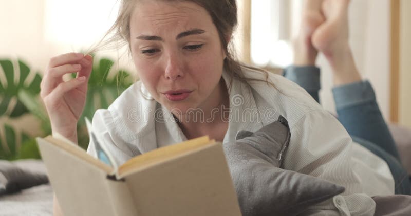 Sensitive Woman Crying while Reading Book at Home Stock Footage - Video ...
