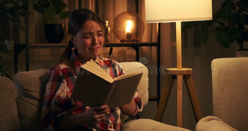 Sensitive Woman Crying while Reading Book at Night Stock Footage ...