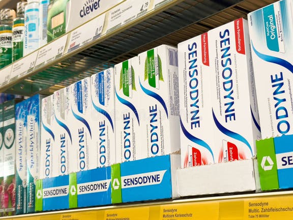 Sensodyne Toothpaste Display on Store Shelf with Various Product ...