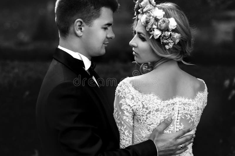 Sensual Beautiful Young Blonde Bride And Handsome Groom Hugging Stock