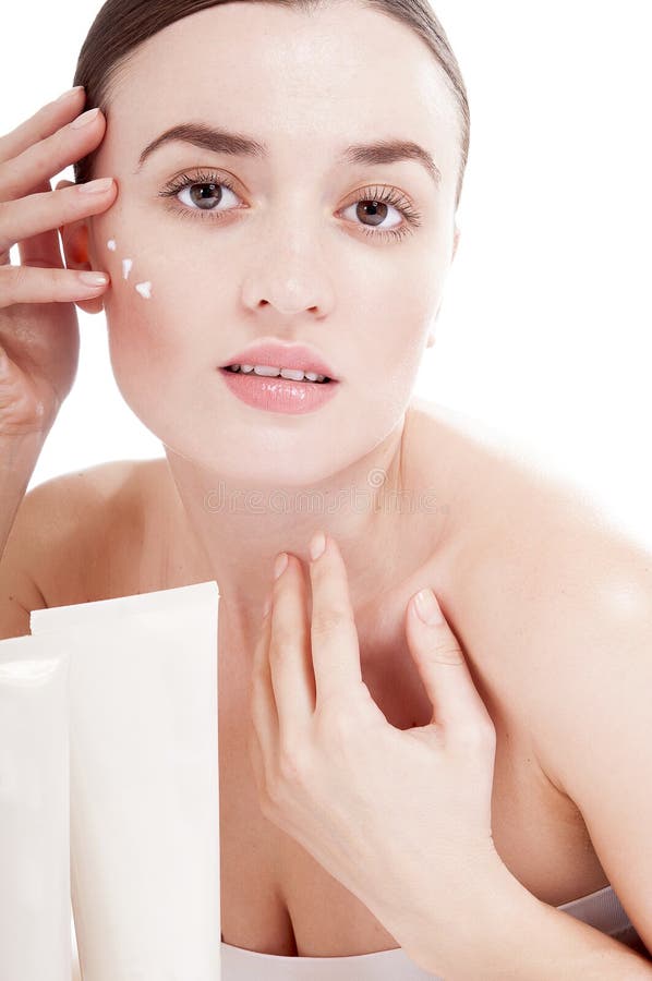 Sensual Woman Applying Cosmetic Cream Treatment On Her Face Stock