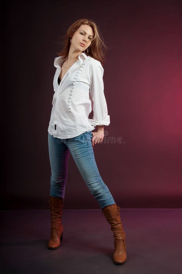 Sensual Woman, Model Sits in Jeans and White Shirt in Studio.Model ...