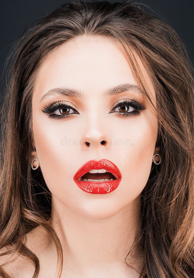 Sensual Woman With Red Lips Black Eyes Makeup Closeup Face Of Fashion