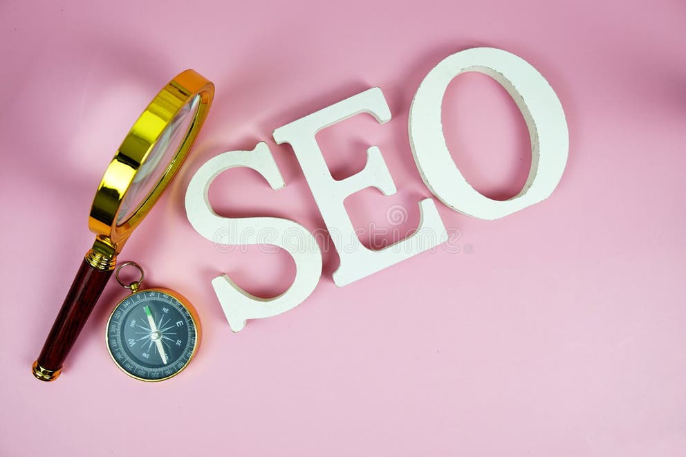 Seo Words (Search Engine Optimization) Letters with Magnifying Glass and Compass on Pink ...