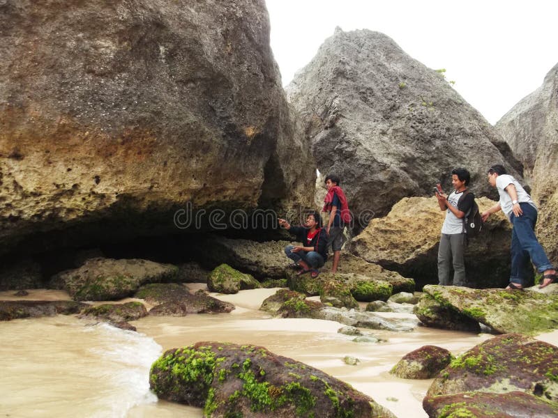 Sepanjang beach editorial stock image. Image of rocks - 79769789