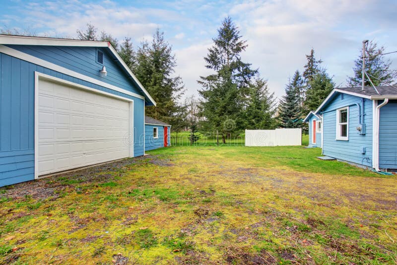 Separate Garage with Blue Trim and White Door Stock Image - Image of ...