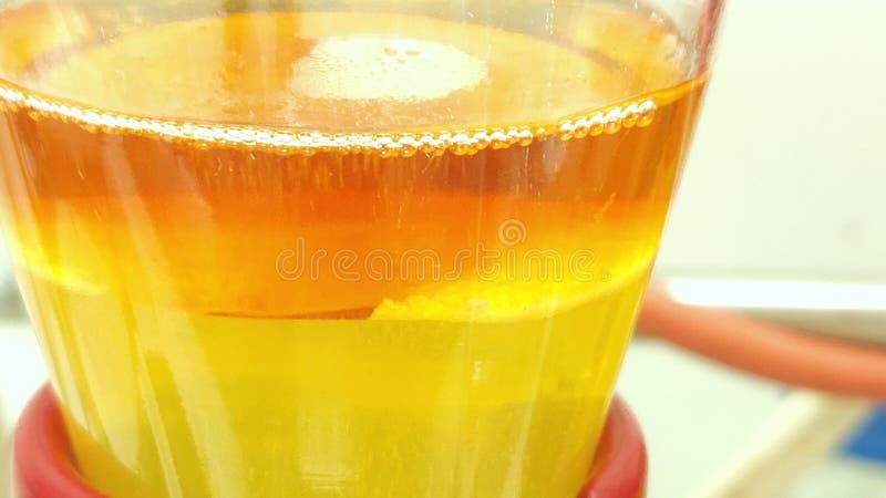 Separation of Organic Layer and Water Layer in Separating Funnel in a ...