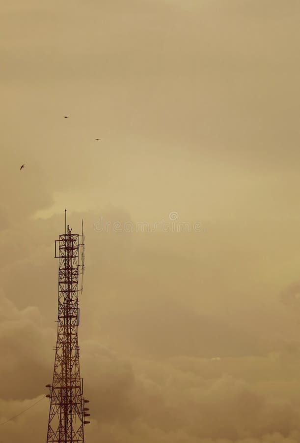 Sepia Image of Telecommunication Tower Against Cloudy Sky Stock Image ...