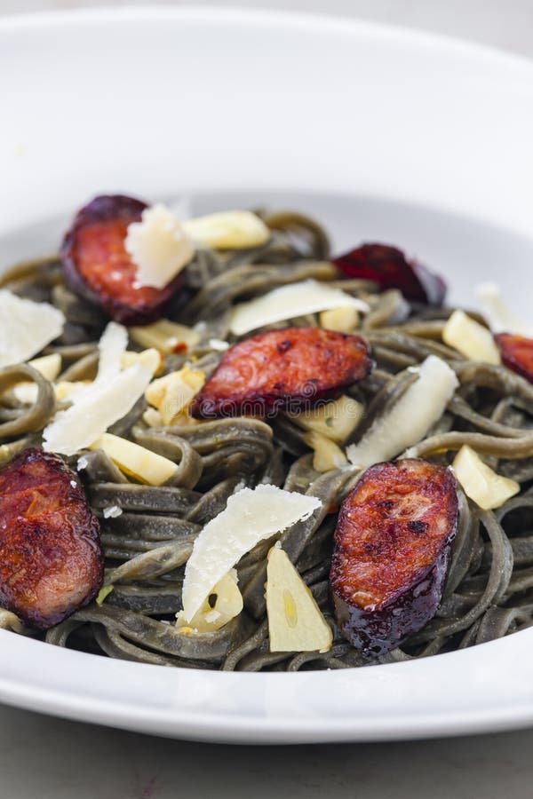 Sepia Spagetti with Chorizo and Parmesan Cheese Stock Image - Image of ...