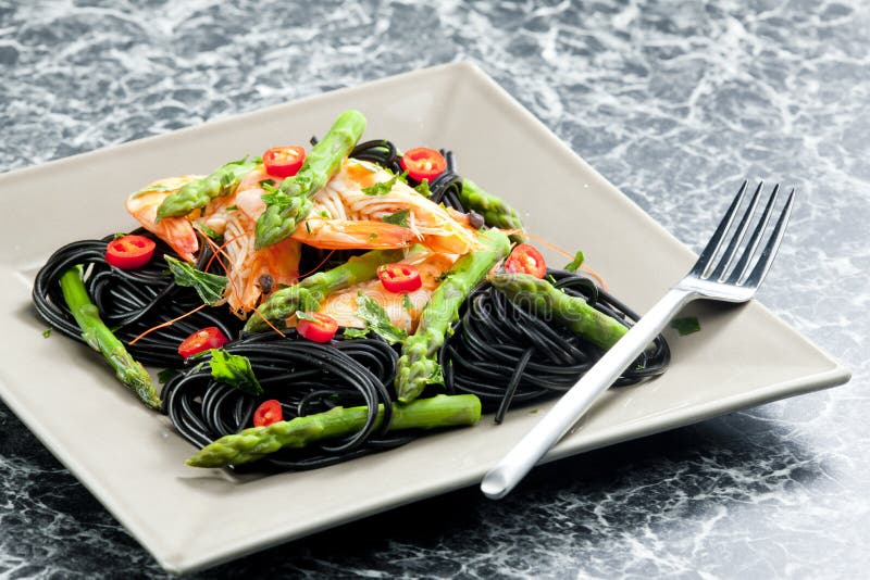 Sepia Spaghetti with Prawns, Asparagus and Chilli Stock Image - Image ...