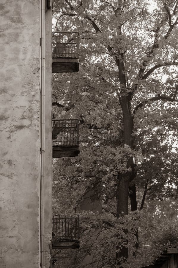 Sepia Vertical Image of Corner of Old Building with Balconies Stock ...