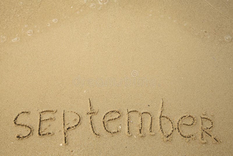 September - Word Drawn on the Sand Beach with the Soft Wave. Stock ...
