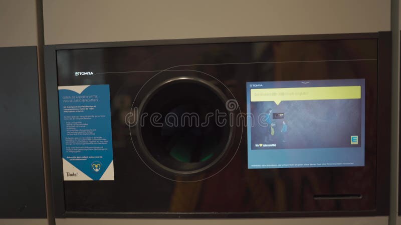 Man Recycling Plastic Bottle at Automatic Machine Collector in Exchange ...