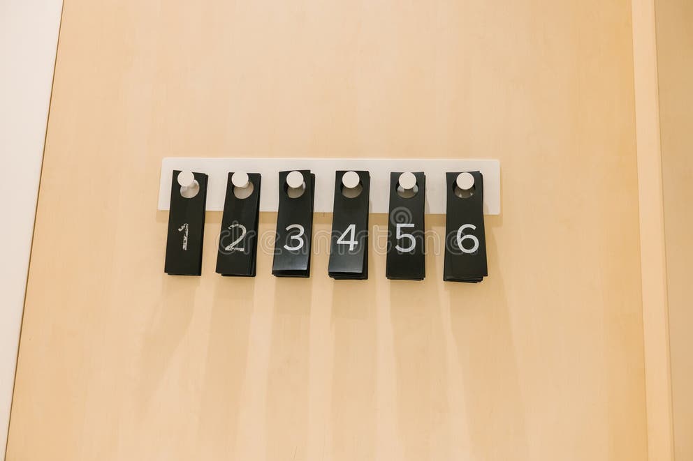 Sequential Number Tags on Wall Hooks for Organization Stock Image ...
