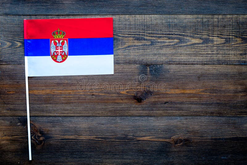 Serbian Flag Concept. Small Flag on Dark Wooden Background Top View ...