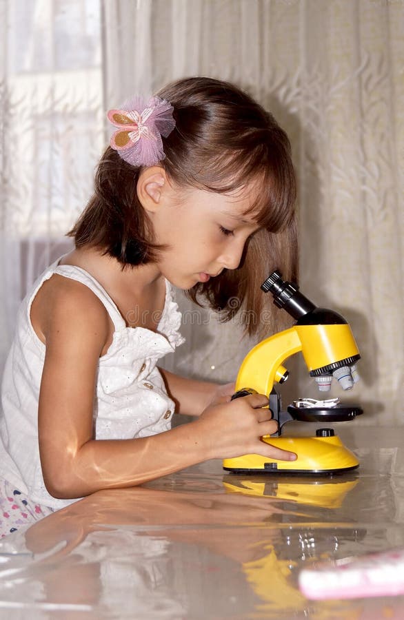 Serching Something New by Looking through the Microscope Stock Photo ...