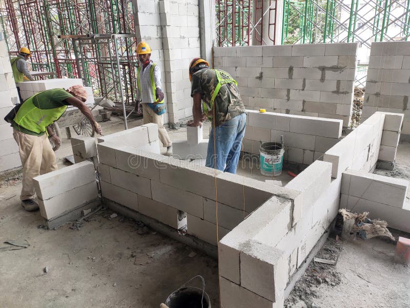 Blockwork by Construction Workers at the Construction Site. Editorial ...