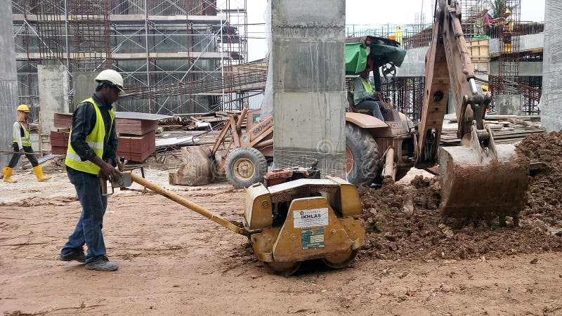 Construction Workers are Using the Baby Compactor To Level and Compact ...