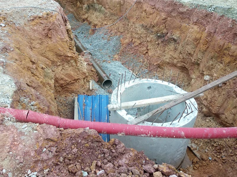 Utility Services Manhole Under Construction at the Construction Site ...