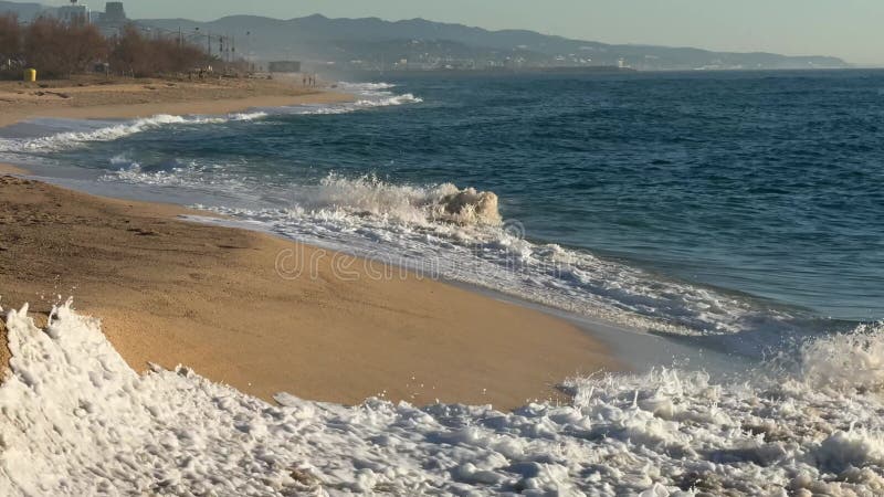 A Serene Beachscape Featuring Gentle Waves Rolling Ashore Beneath Clear ...